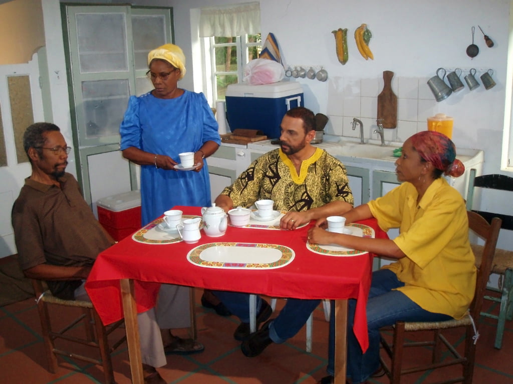 Premiere Social Commentator “Baba” Elombe Mottley poses; “Where is ...